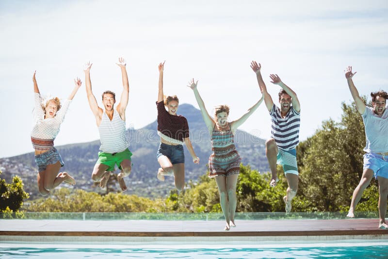 Group of Friends Jumping in Swimming Pool Stock Image - Image of ...