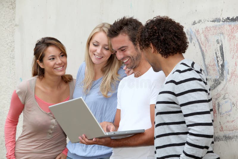 Group of Friends with Laptop Stock Photo - Image of wall, blond: 15711278