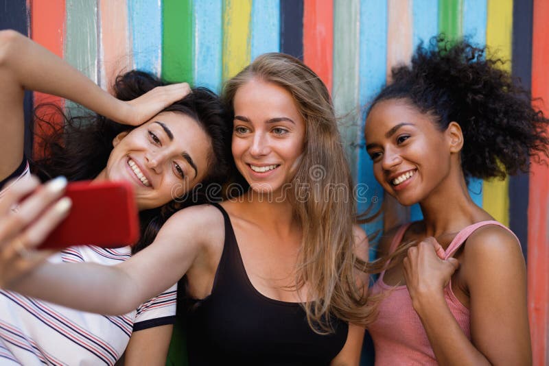 Group of Friends Looking at Smart Phone Stock Photo - Image of happy ...