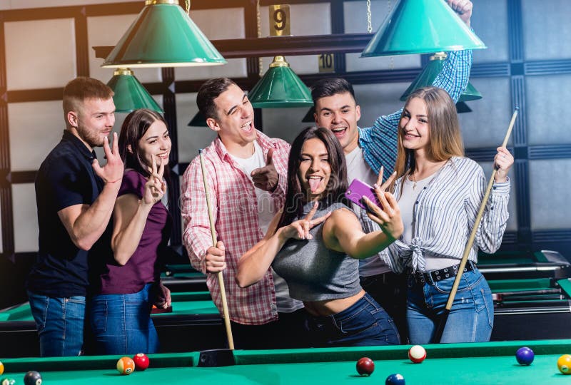 A Group of Friends Makes a Selfie at the Pool Table. Stock Image ...