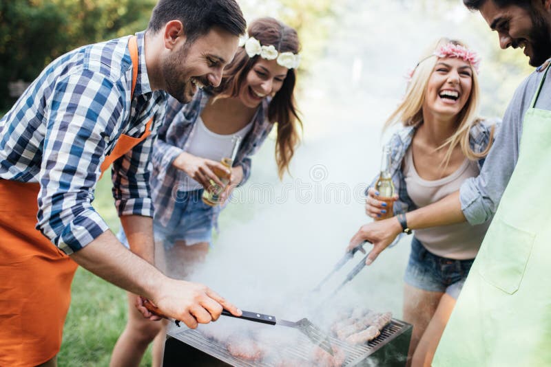 Group of Friends Making Barbecue in the Nature Stock Image - Image of ...