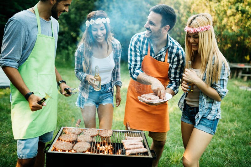 Group of Friends Making Barbecue in the Nature Stock Photo - Image of ...