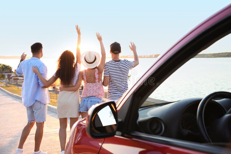Group of Friends Near Car Outdoors at Sunset, Back View. Summer Trip ...