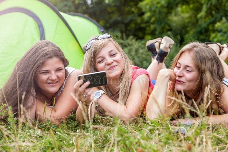 Group of Friends Outdoors with a Smart Phone Stock Photo - Image of ...