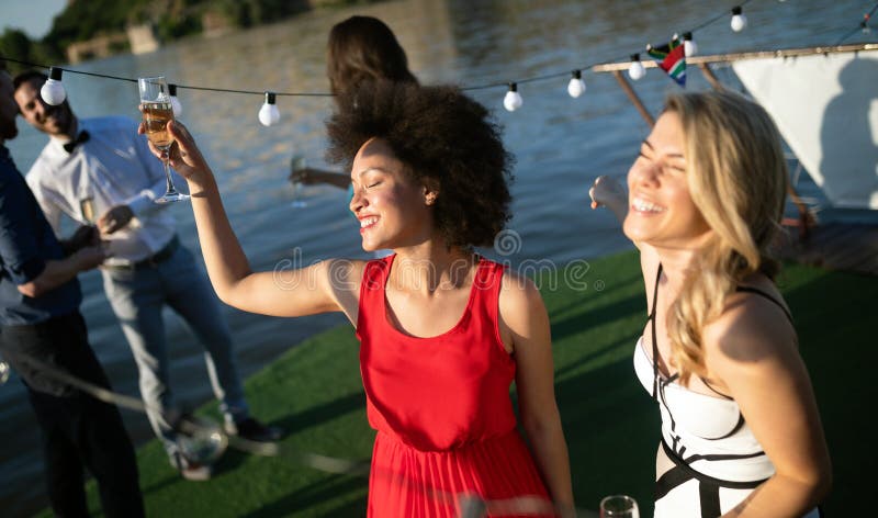 Group of Friends at Party Dancing and Smiling Together Stock Photo ...