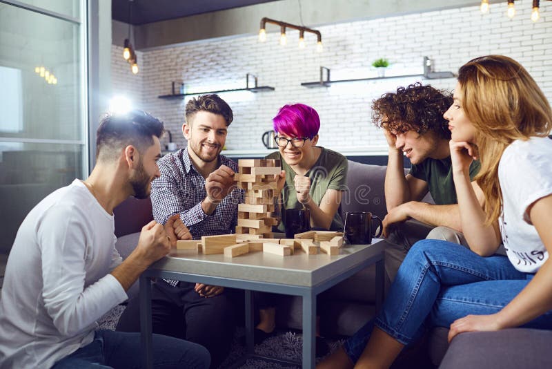 A Group of Friends Play Board Games in the Room. Stock Photo - Image of ...