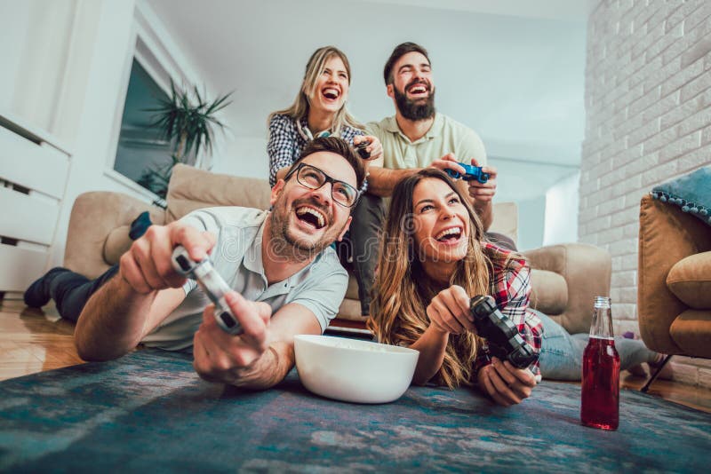 Group of Friends Play Video Games Together at Home Stock Image - Image ...