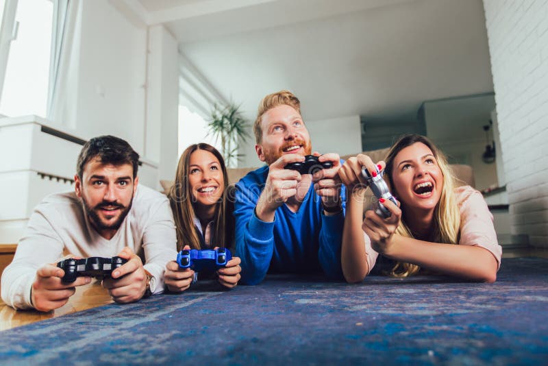 Friends Play Video Games Together at Home, Having Fun Stock Photo ...