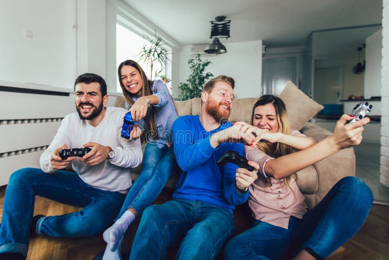 Friends Play Video Games Together at Home, Having Fun Stock Photo ...