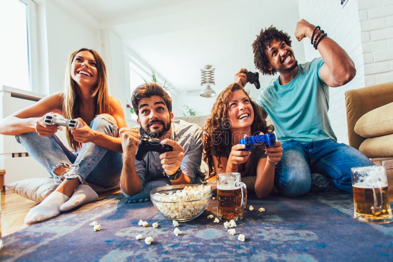 Friends Play Video Games Together at Home, Having Fun Stock Photo ...