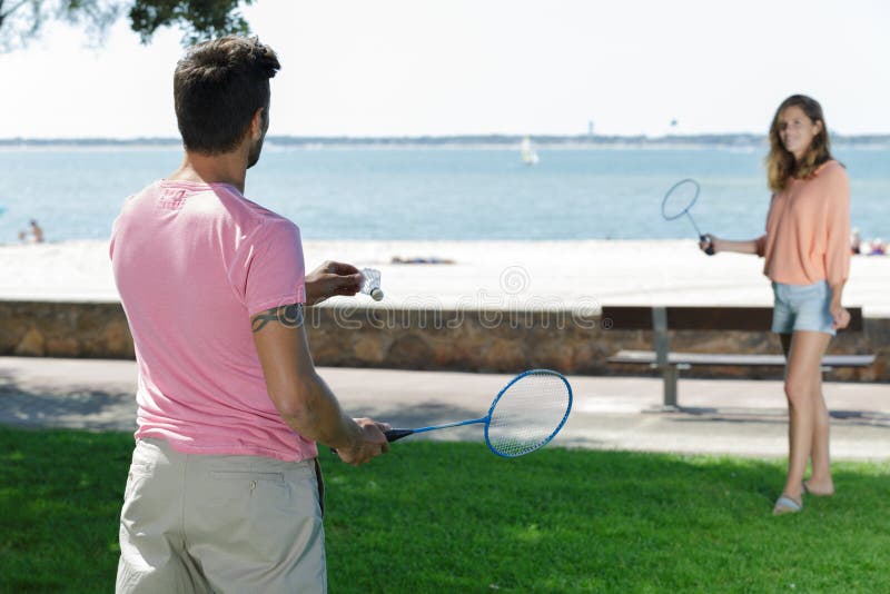 Group Friends Playing Badminton in Beach Stock Photo - Image of ...