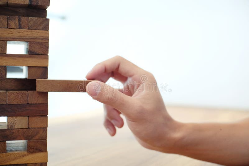 Group of Friends Playing Blocks Wood Game on the Table Folded Pu Stock ...