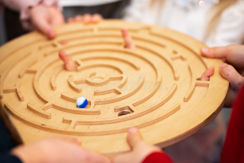 A Group of Friends is Playing a Board Game. Games for Parties Stock ...