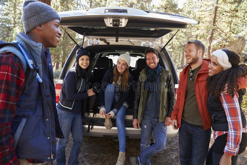 Group of Friends Prepare for a Hike at the Open Back of Car Stock Photo ...
