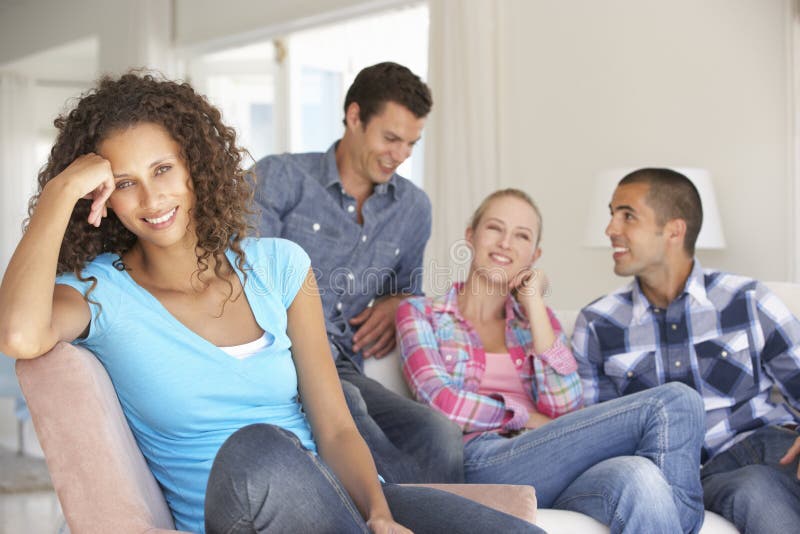Group of Friends Relaxing on Sofa at Home Together Stock Image - Image ...