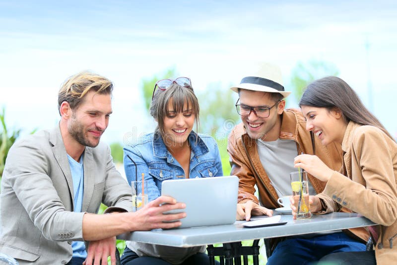 Group of Friends in Restaurant Using Tablet Stock Photo - Image of guys ...