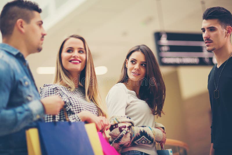 Group of Friends Shopping in Mall Together Stock Photo - Image of ...