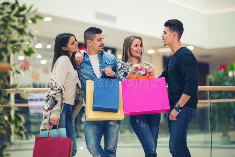 Group of Friends Shopping in Mall Together Stock Photo - Image of ...