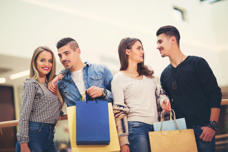 Group of Friends Shopping in Mall Together Stock Image - Image of ...