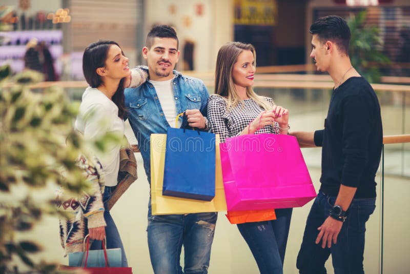 Group of Friends Shopping in Mall Together Stock Image - Image of ...