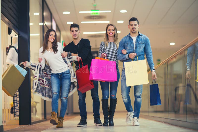 Group of Friends Shopping in Mall Together Stock Image - Image of ...