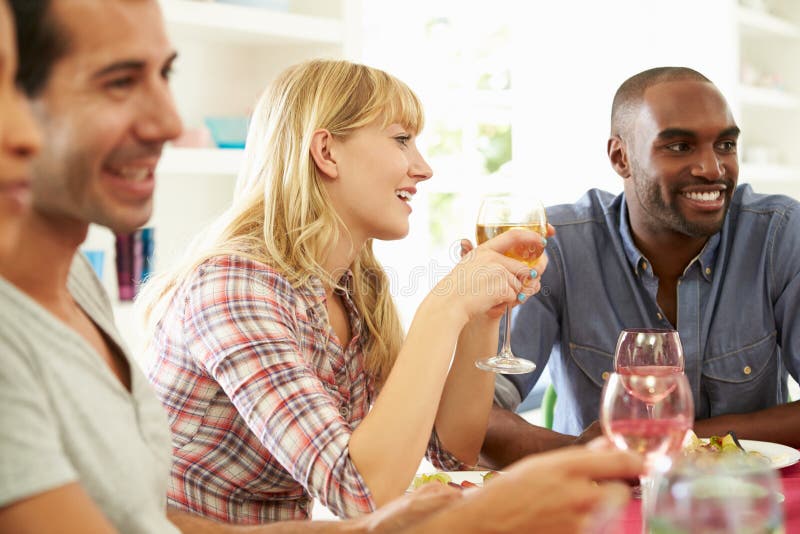 Group Of Friends Sitting Around Table Having Dinner Party - Stock Image ...