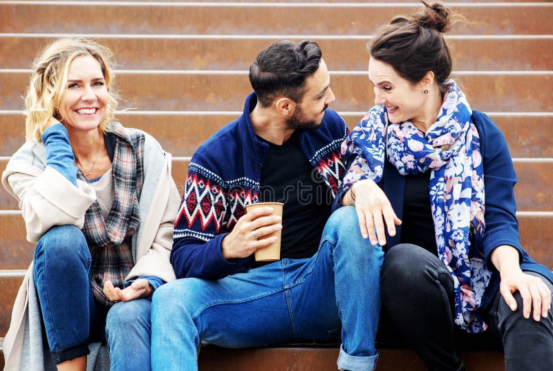 Group of Friends Sitting Outside on Stairs Stock Image - Image of ...