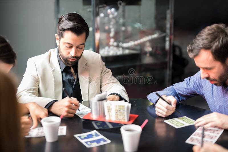 Friends Playing Bingo in a Casino Stock Photo - Image of people ...