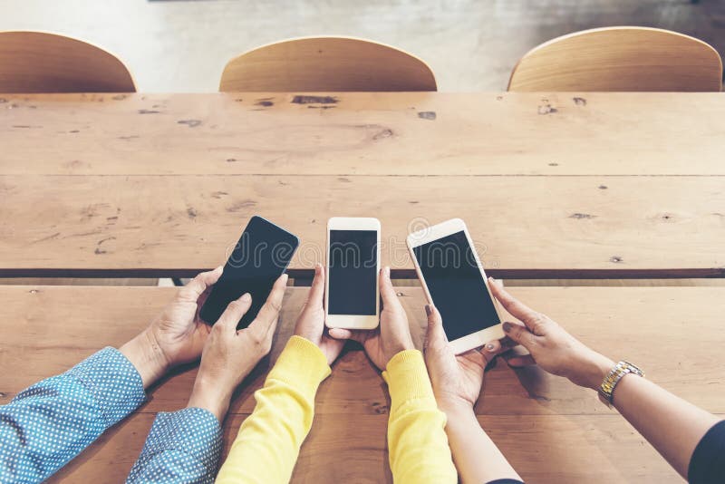Group Friends Sitting and Using Smartphone for Connection Technology ...
