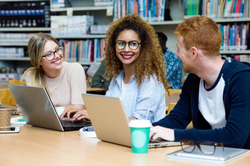 Group of Friends Studying in a University Library. Stock Image - Image ...