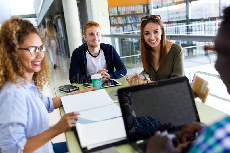 Group of Friends Studying in a University Library. Stock Image - Image ...