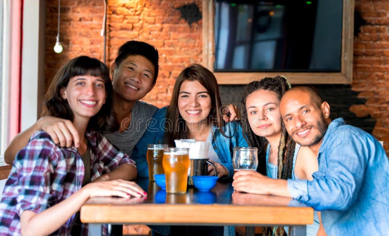 A Group of Friends Together in a Bar Stock Image - Image of beer ...