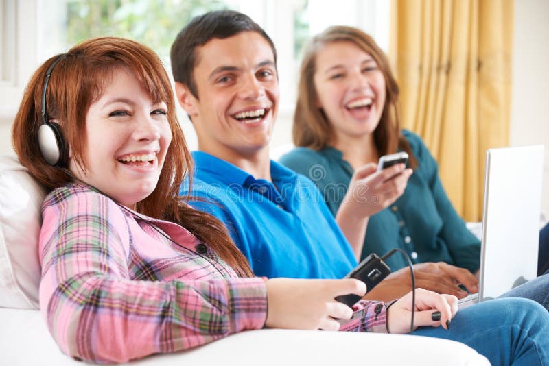 Group of Friends Using Digital Technology at Home Stock Image - Image ...