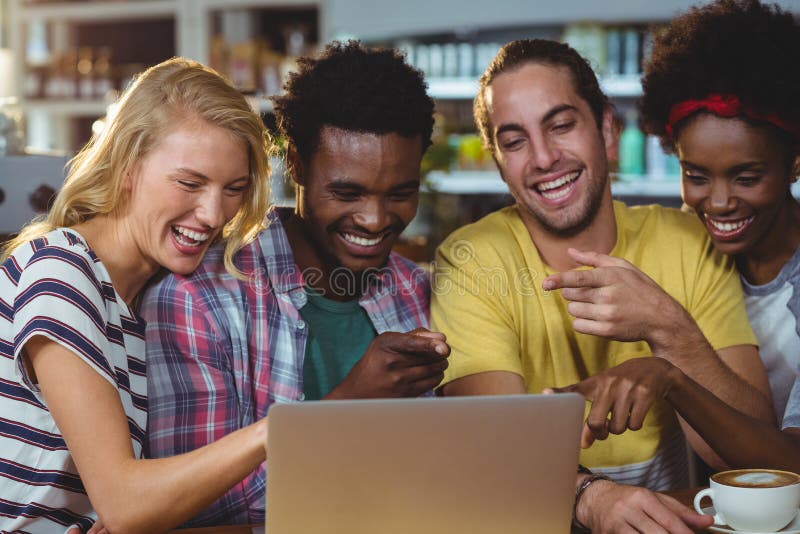 Group of Friends Using Laptop while Having Cup of Coffee Stock Image ...