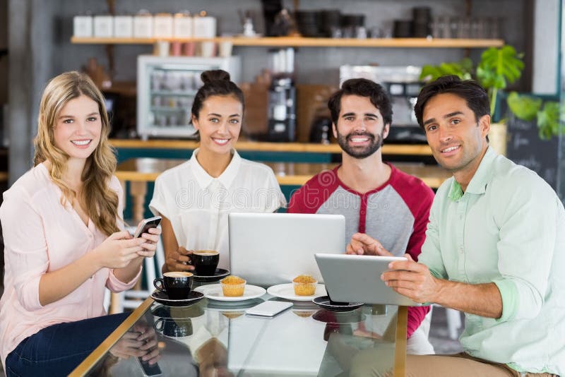 Group of Friends Using Mobile Phone, Digital Tablet and Laptop Stock ...