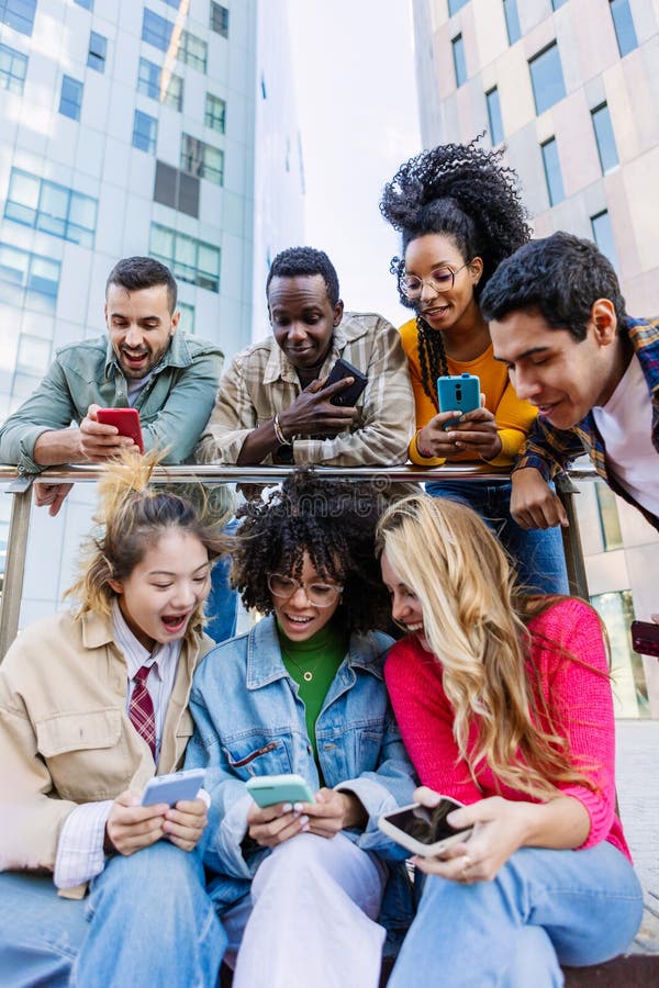 Group of Friends Using Mobile Phone Outside Stock Photo - Image of ...