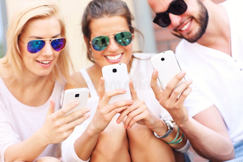 Group of Friends Using Smart Phones Stock Photo - Image of friendship ...
