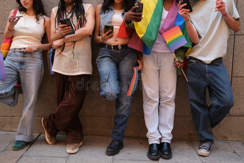 Young People Using Smartphones and Showing Rainbow Flags Stock Image ...
