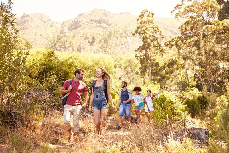 Group of Friends on Walk through Countryside Together Stock Photo ...