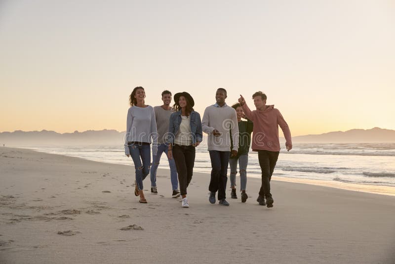 Group Of Women Walking Along The Beach Stock Image - Image of season ...