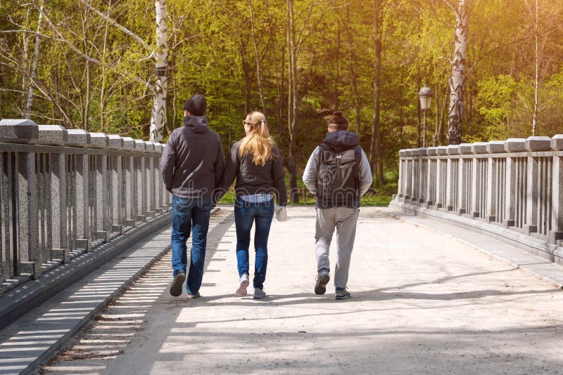 Group of Friends Walking in the Spring Park Editorial Image - Image of ...