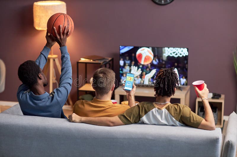 Group of Friends Watching Basketball Match at Home and Drinking Beer ...