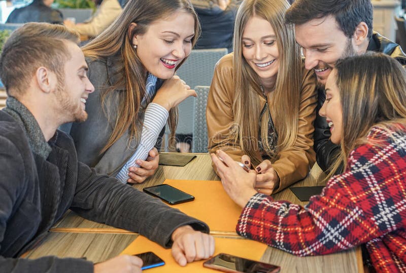 Group of Friends Watching Mobile Phones and Having Fun Stock Image ...