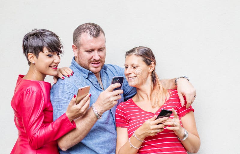 Group of Friends Watching Smart Mobile Phones Stock Image - Image of ...