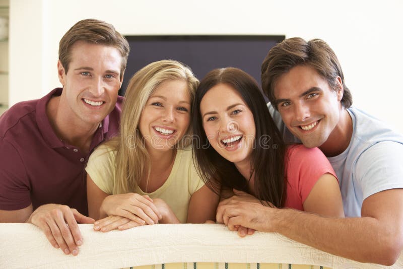 Group of Friends Watching Widescreen TV at Home Stock Image - Image of ...
