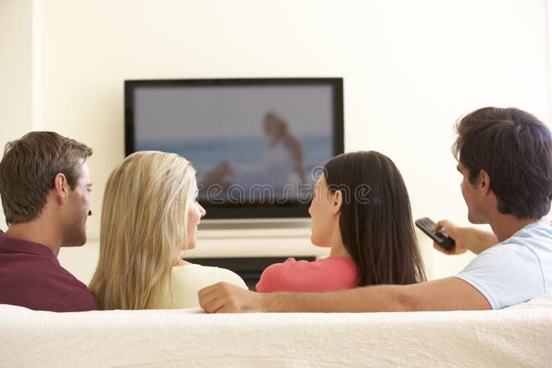 Group of Friends Watching Widescreen TV at Home Stock Photo - Image of ...