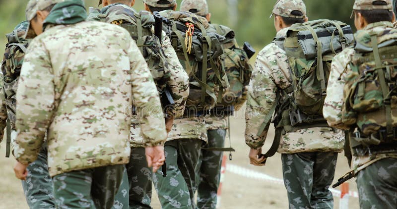 Group of Soldiers Waiting for Military Evacuation Transport in Forest ...