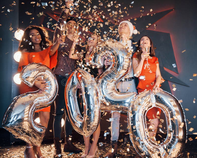 A Group of Fun Young Beautiful Multinational People Throwing Confetti ...