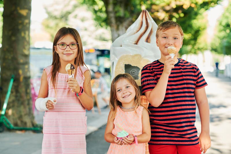 Group of 3 Funny Kids Eating Ice Cream Outdoors Stock Photo - Image of ...