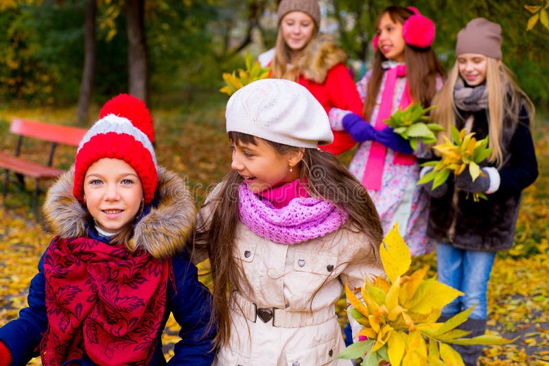 Group of Girls in Autumn Park with Leafs Stock Image - Image of fashion ...